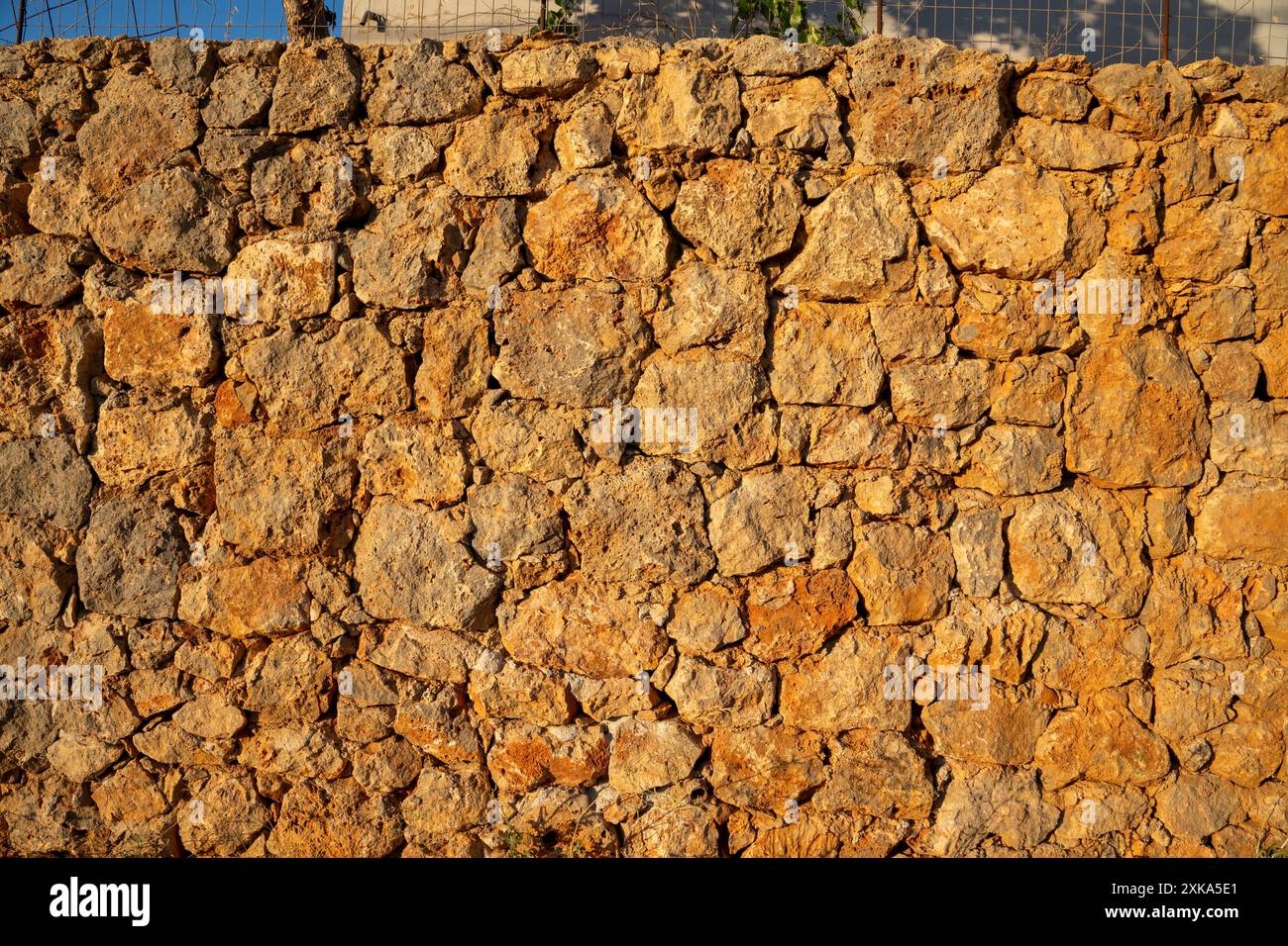 Natural rock wall, photographed at golden hour Stock Photo - Alamy