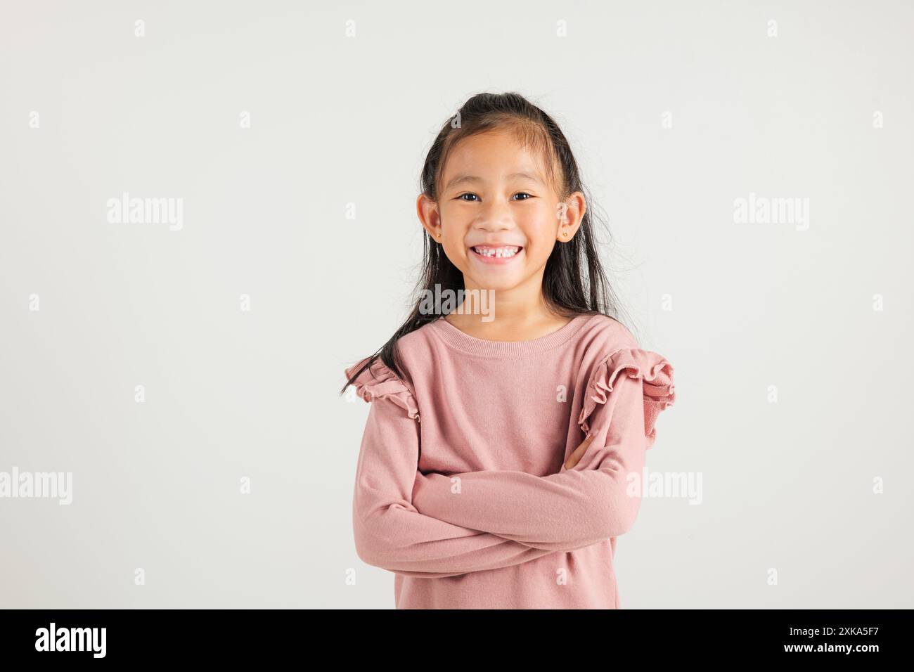 Asian happy portrait cute young kid girl smiling confidence with arms ...