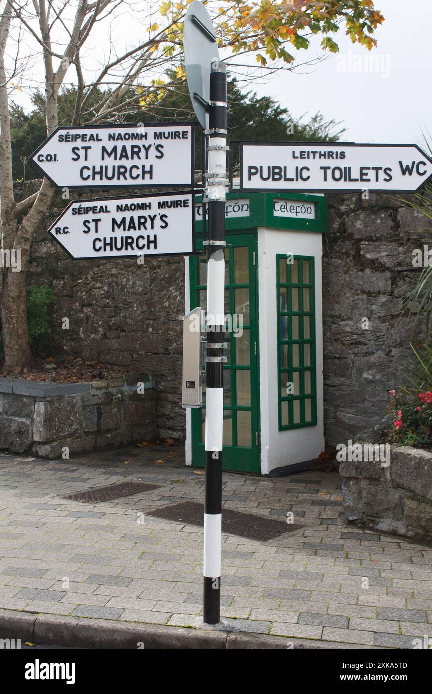 Irish Sign post by rural phone box Stock Photo - Alamy