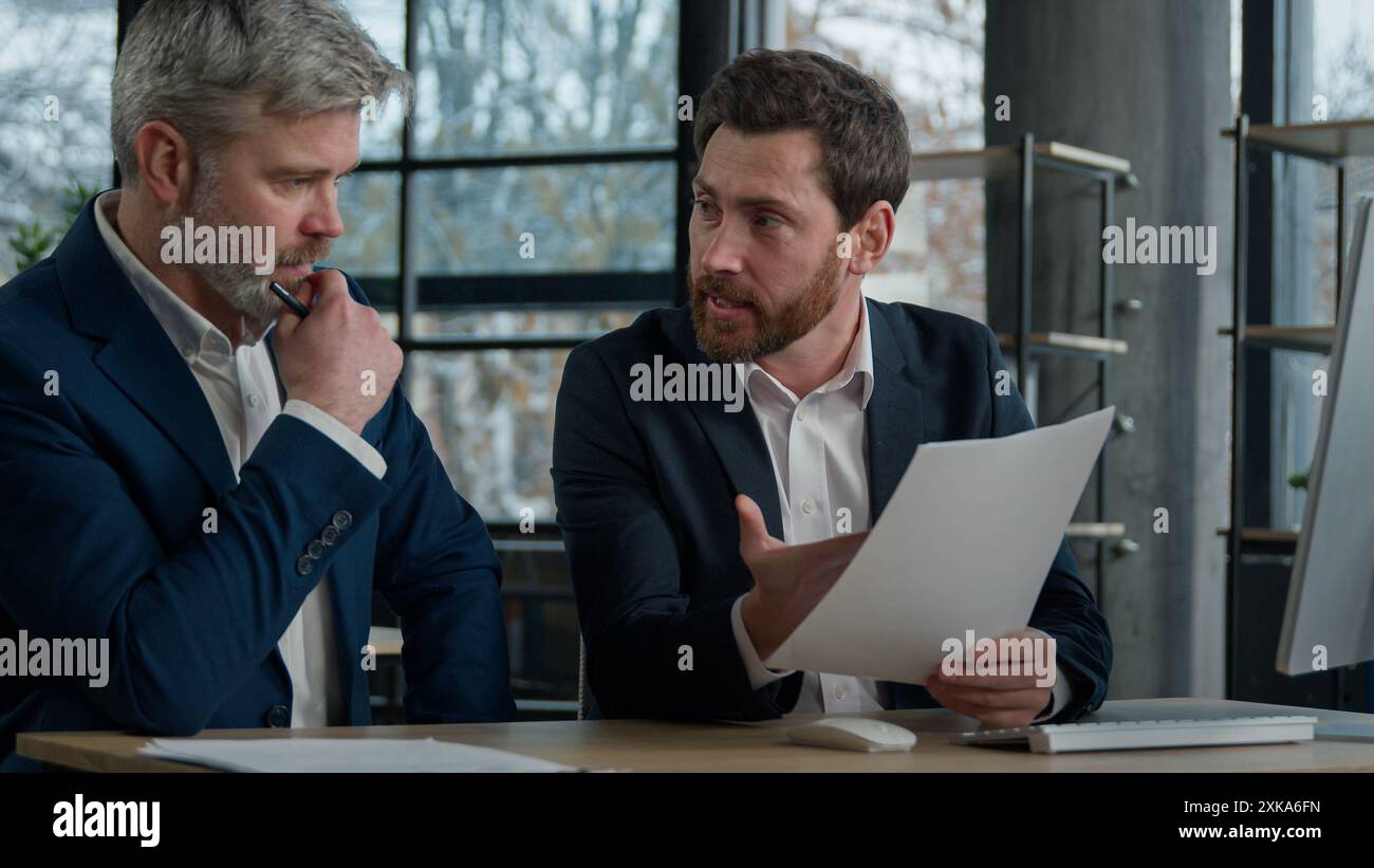Two disgruntled furious Caucasian businessmen arguing about bad ...