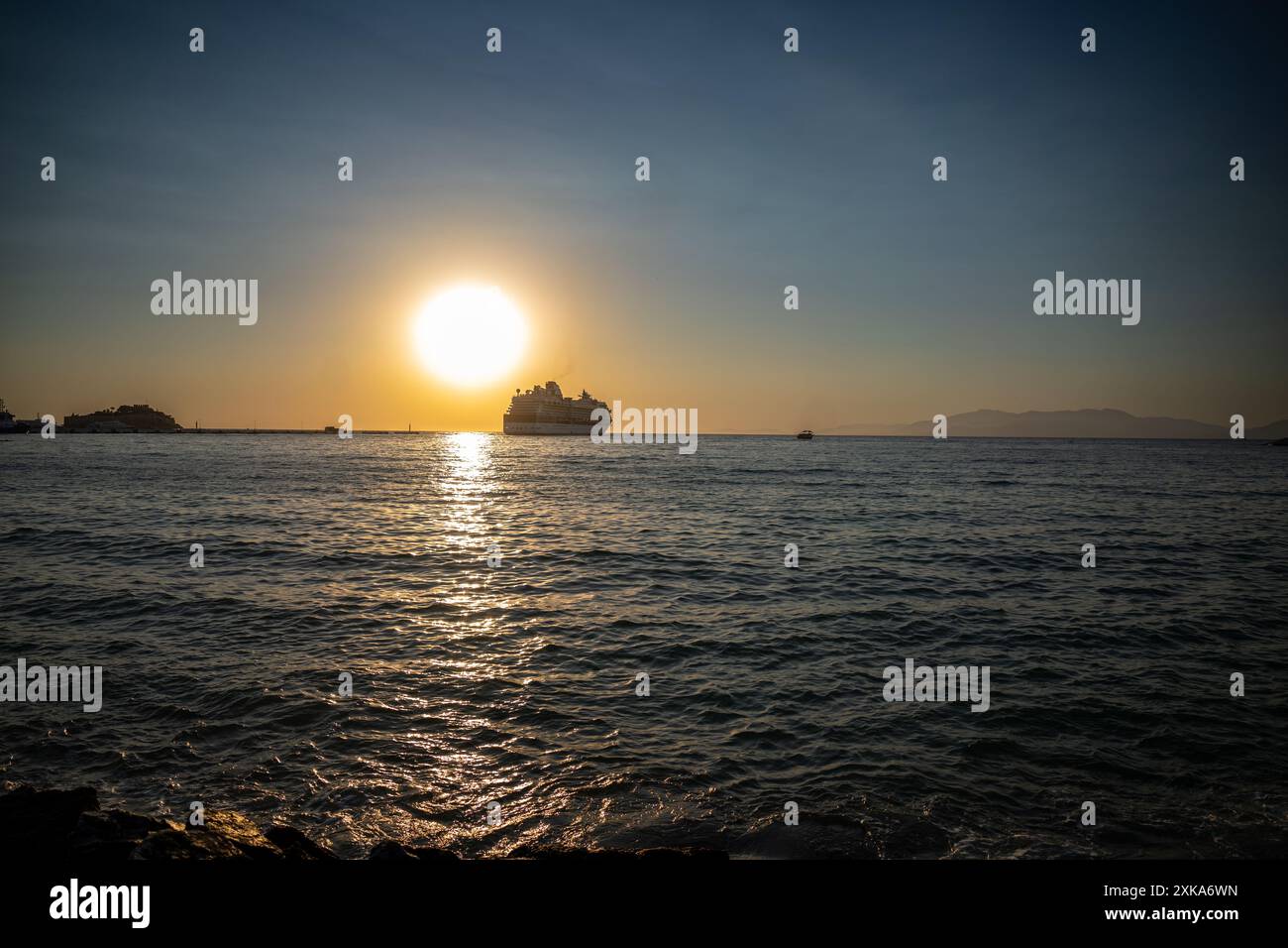 Sunset View at the Beach with Silhouette of a Large Passenger Ship ...