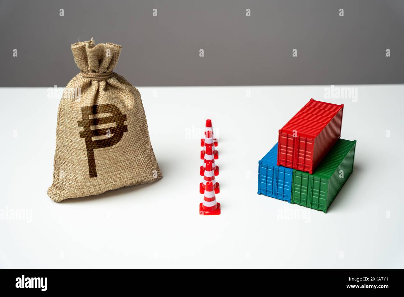 Shipping containers with goods and philippine peso money bag are ...