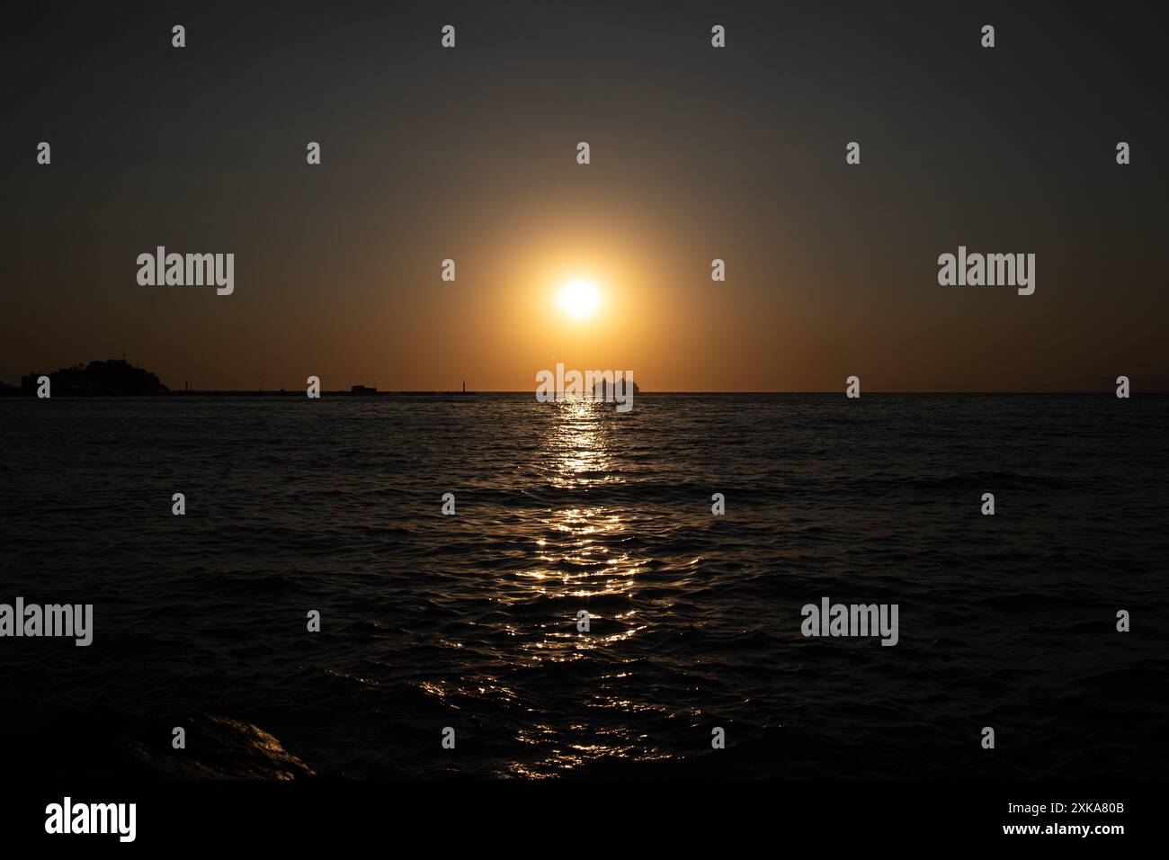 Sunset View at the Beach with Silhouette of a Large Passenger Ship ...