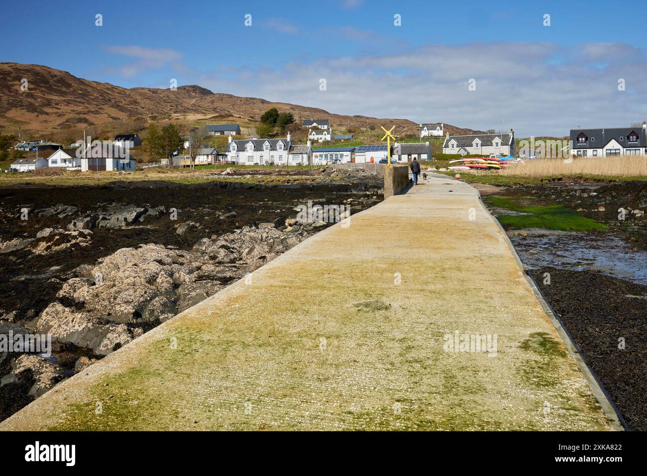 From the bay a low level view along the concrete jetty towards the ...