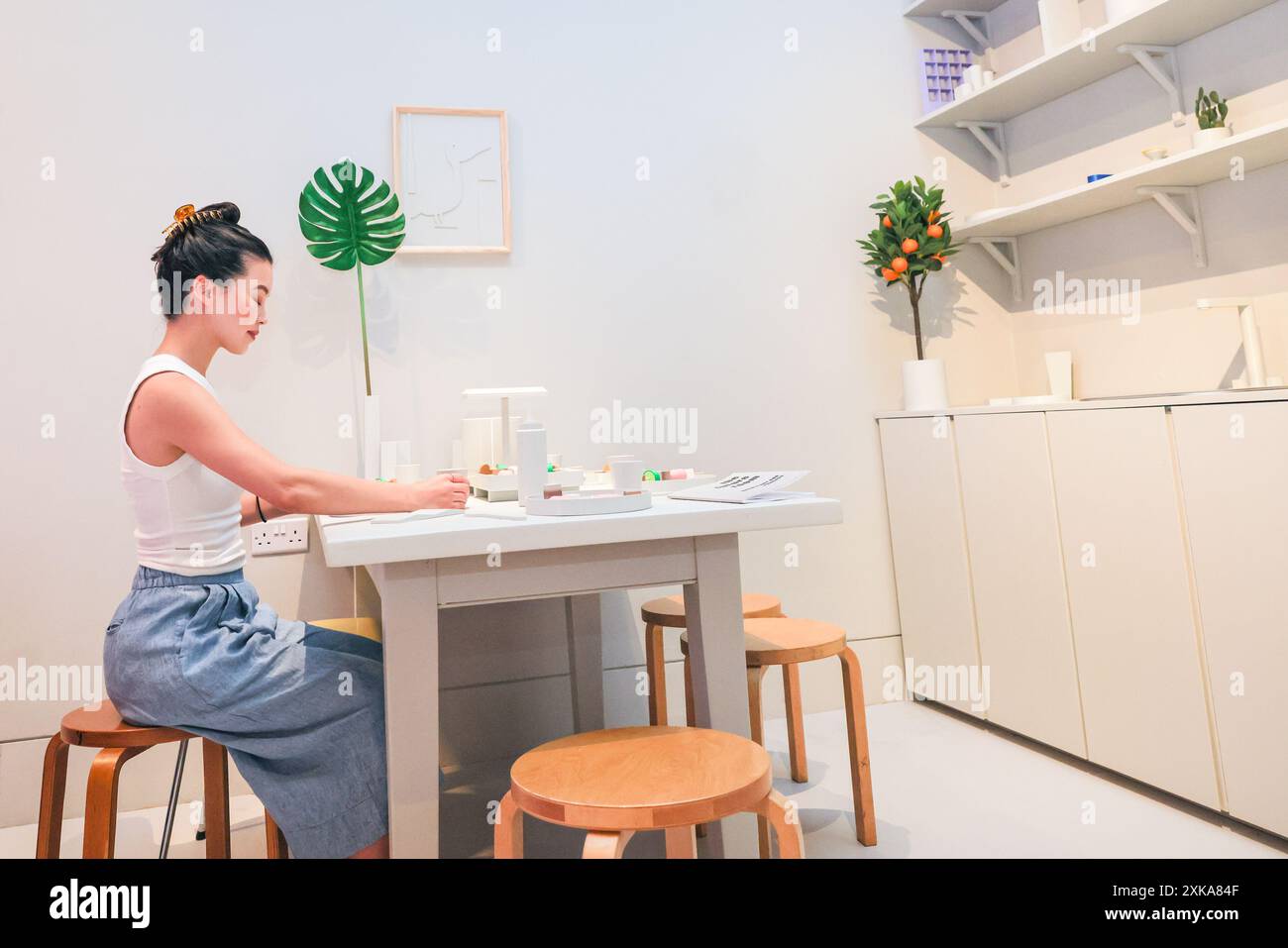 London, 22st July 2024. Museum staff in the 'A Converted Flat in 2049 ...