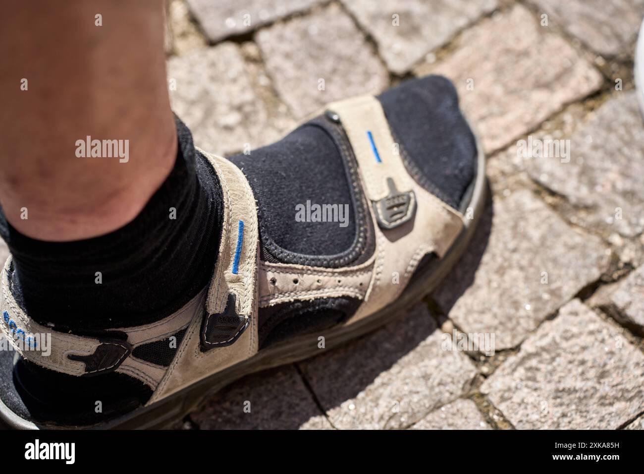 Malcesine, Lake Garda, Italy - 20 July 2024: Symbolic image of a typical German man wearing ...