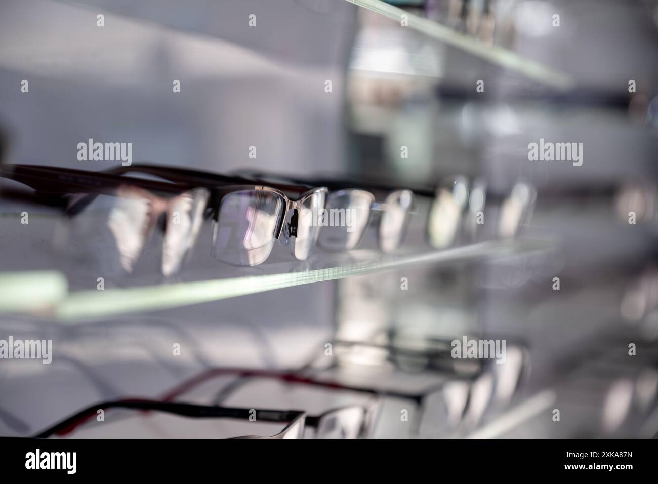 medical eyeglasses are presented on shelf for selling with light ...