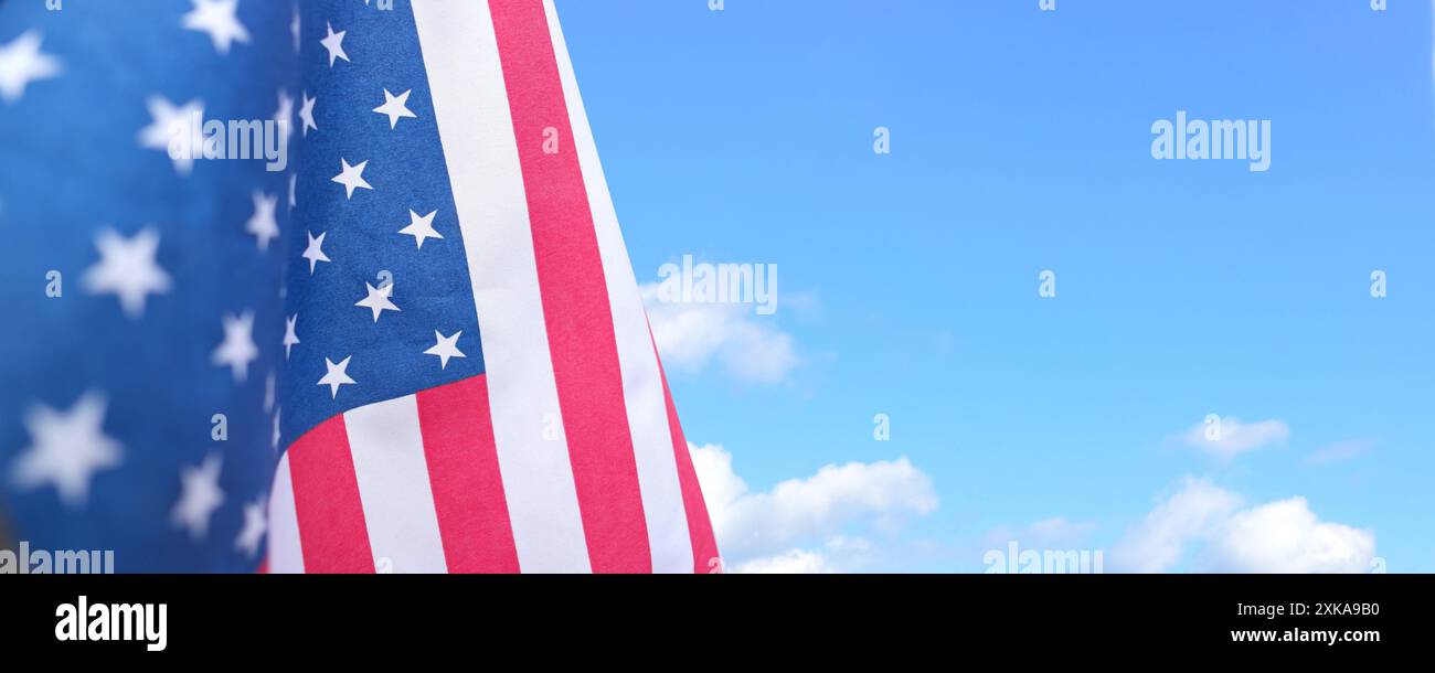 American flags wave close with blue sky and cloud background ...
