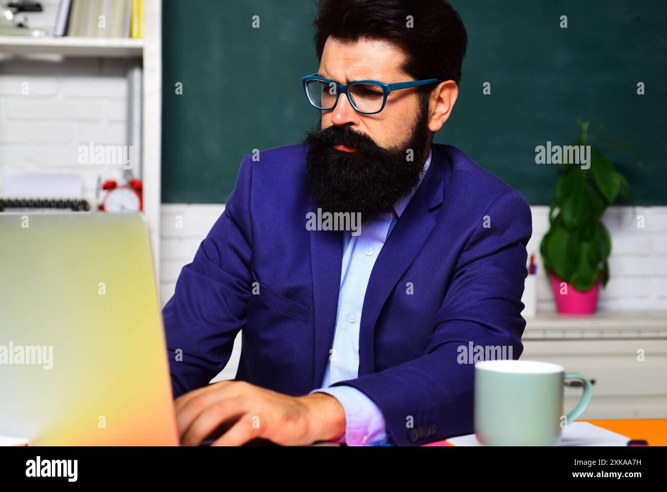 Serious lecturer preparing class in hi-res stock photography and images ...