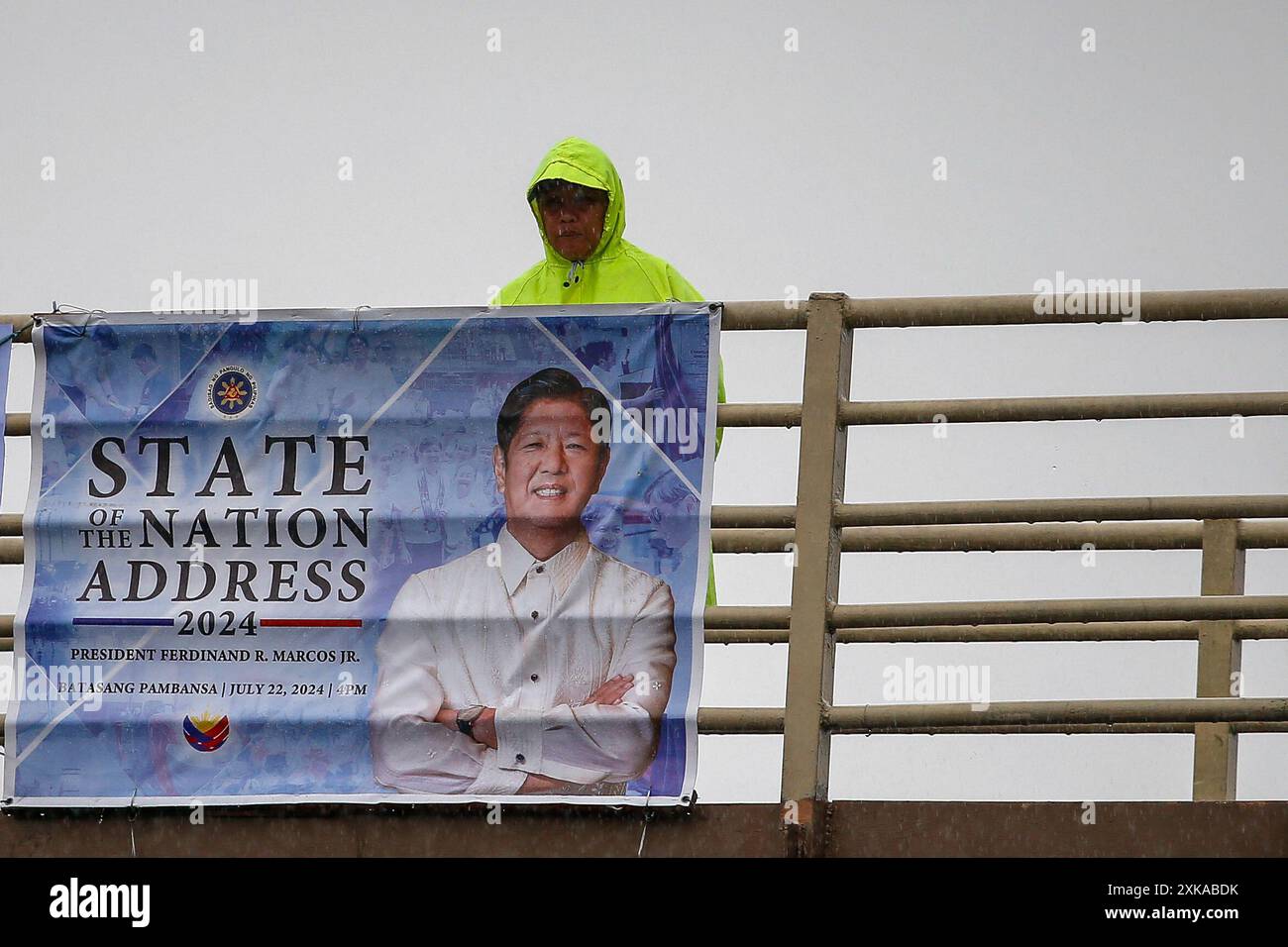 A police officer stands along a footbridge during a rally ahead of the ...