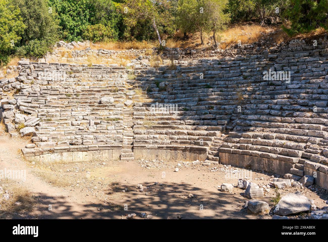 A large stone amphitheater with a stone wall surrounding it. The stone ...