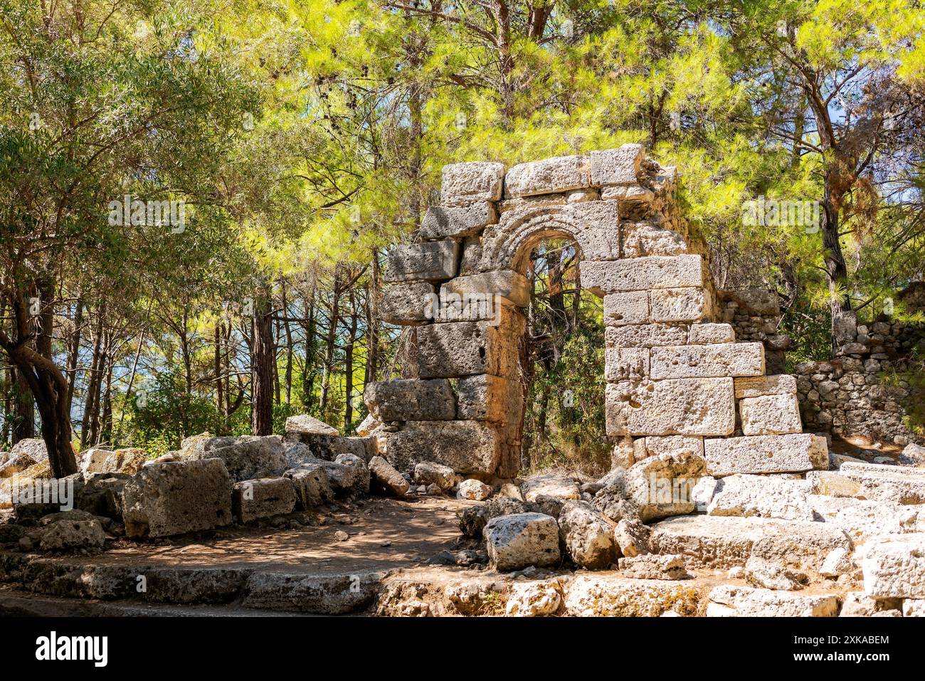 A stone archway with a small opening in the middle. The archway is ...