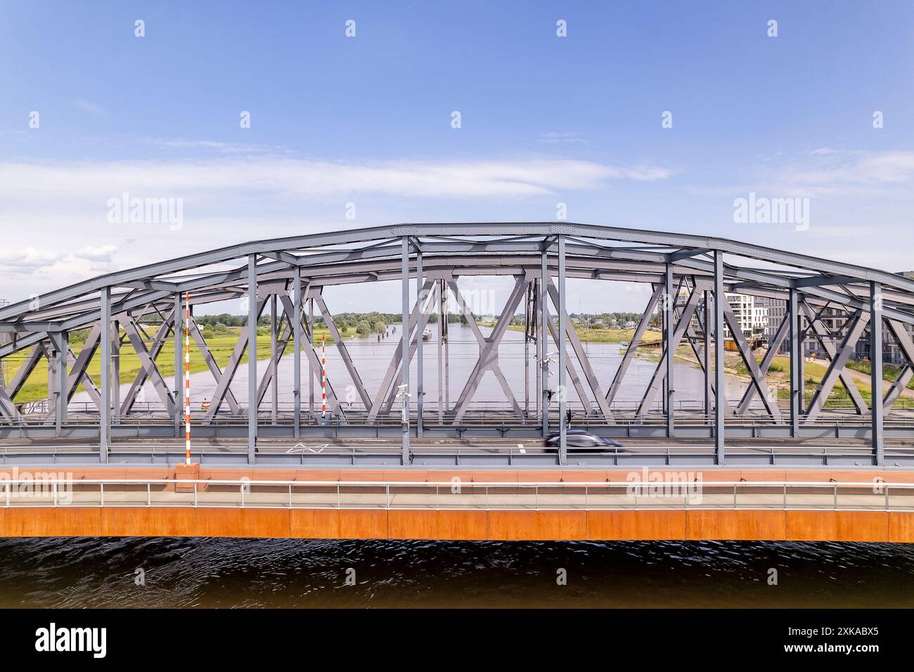 Aerial of steel draw bridge for train and traffic over the river IJssel ...
