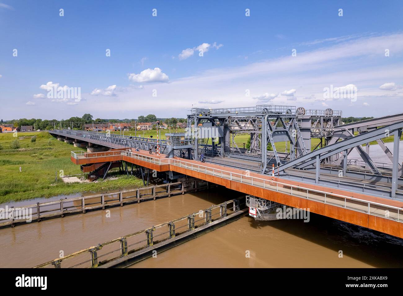 Aerial of steel draw bridge for train and traffic over the river IJssel ...