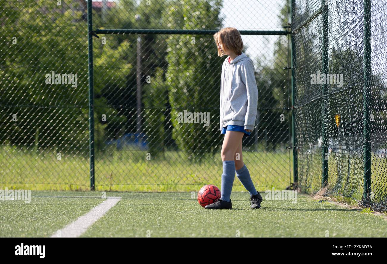 Girl Leads Ball On Football Field During Football Practice Stock Photo ...