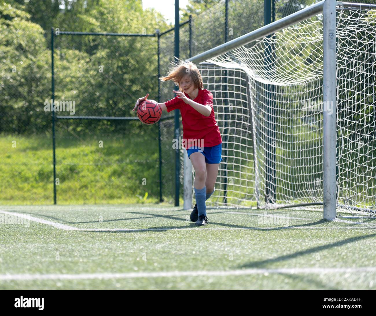 Goalkeeper trying catch football hi-res stock photography and images ...