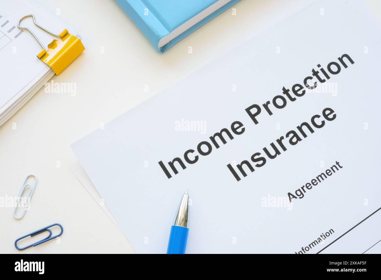 Income protection insurance agreement form and pen Stock Photo - Alamy