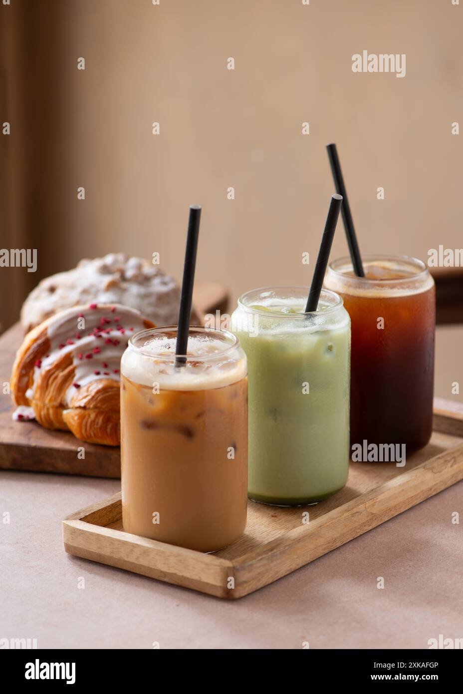 Selection of iced coffee and matcha drink on a coffee shop table ...