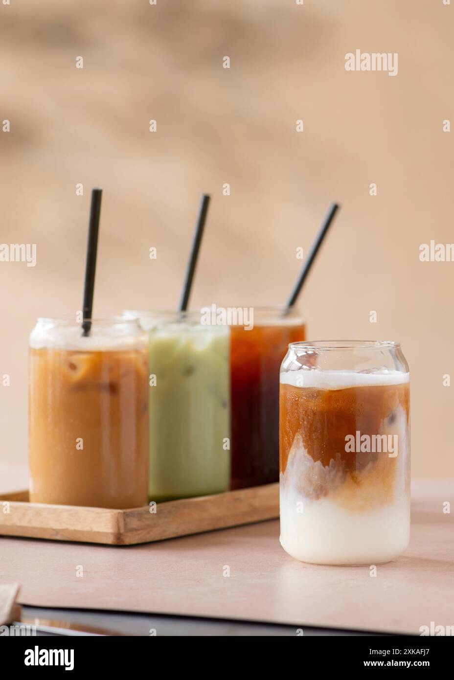 Selection of iced coffee and matcha drink on a coffee shop table ...