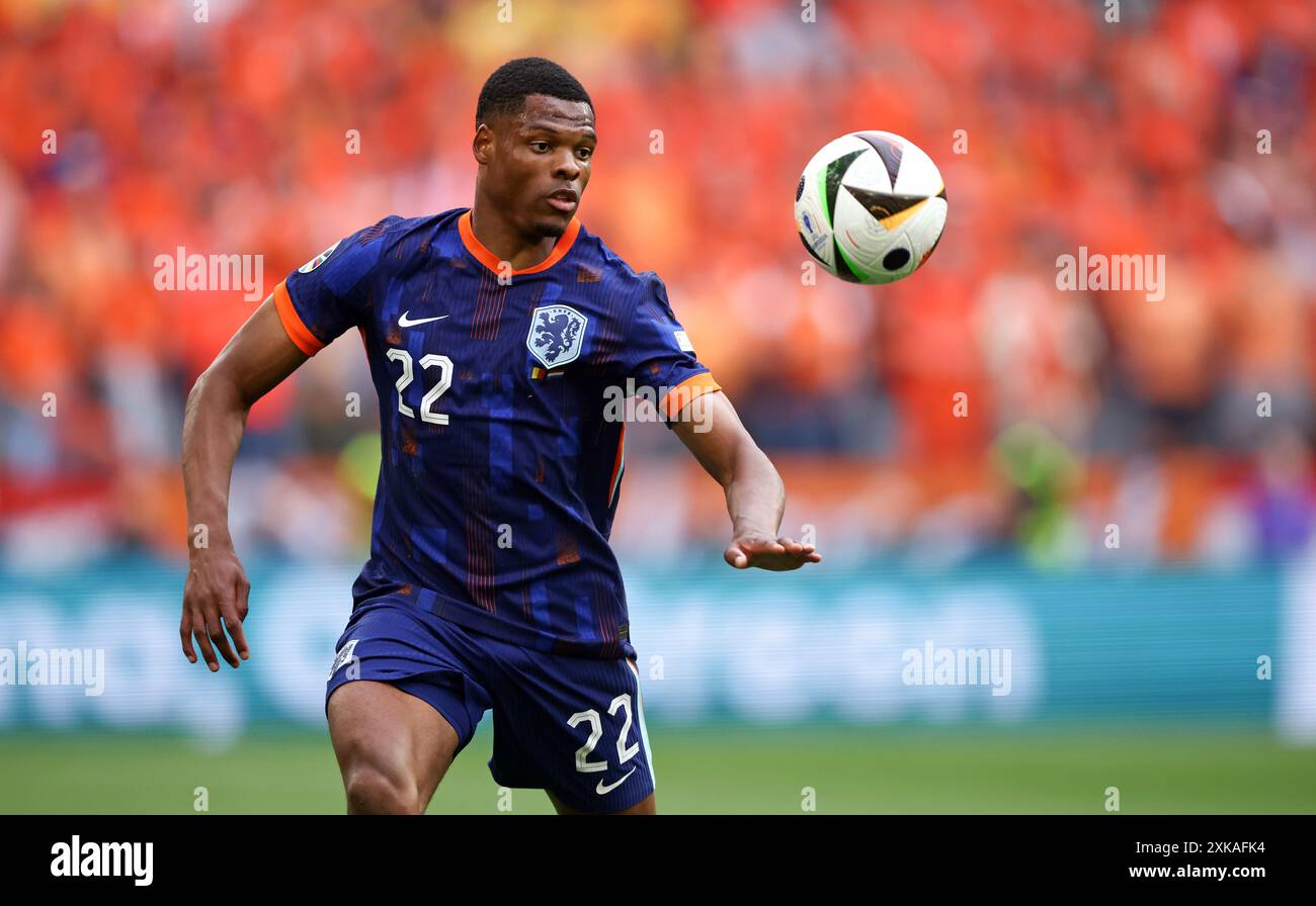 MUNICH, GERMANY - JULY 02: Denzel Dumfries of Netherlands runs with a ...