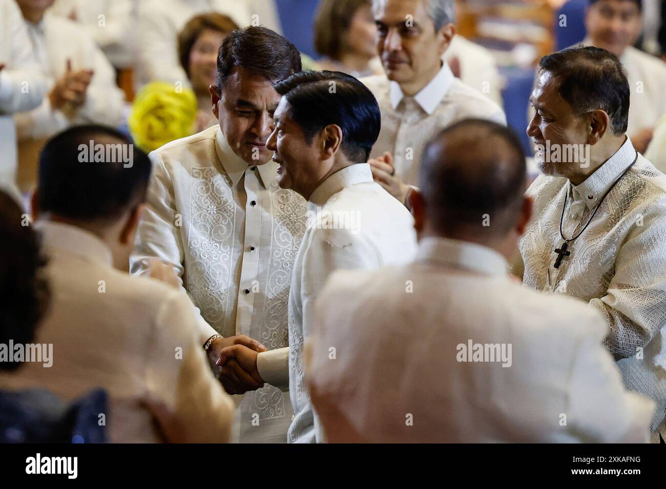 Philippine President Ferdinand Marcos Jr. is greeted at the plenary ...