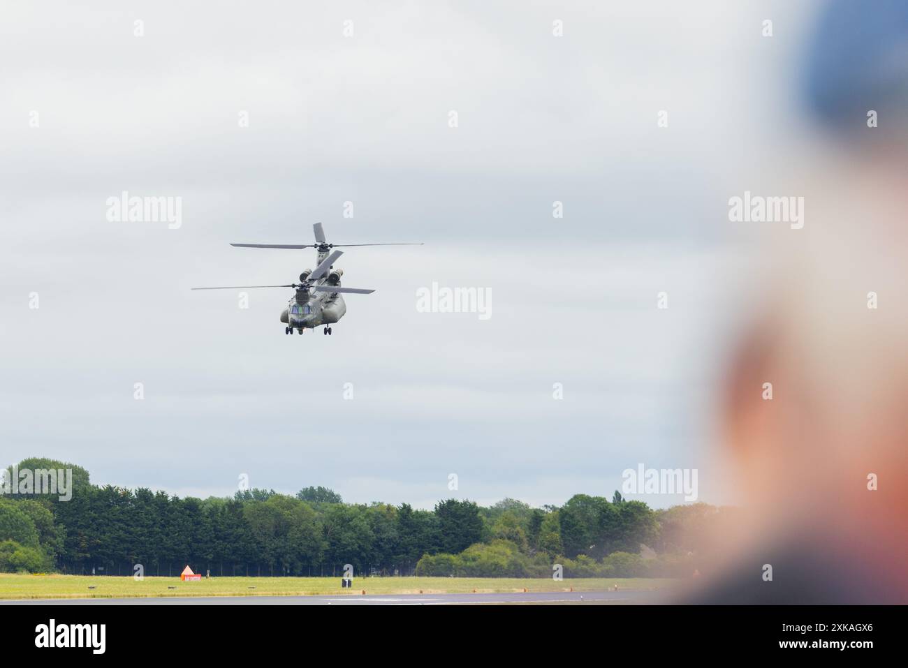 Fairford, UK. 21 JUL, 2024. RAF Chinook flies along the runway at RAF ...