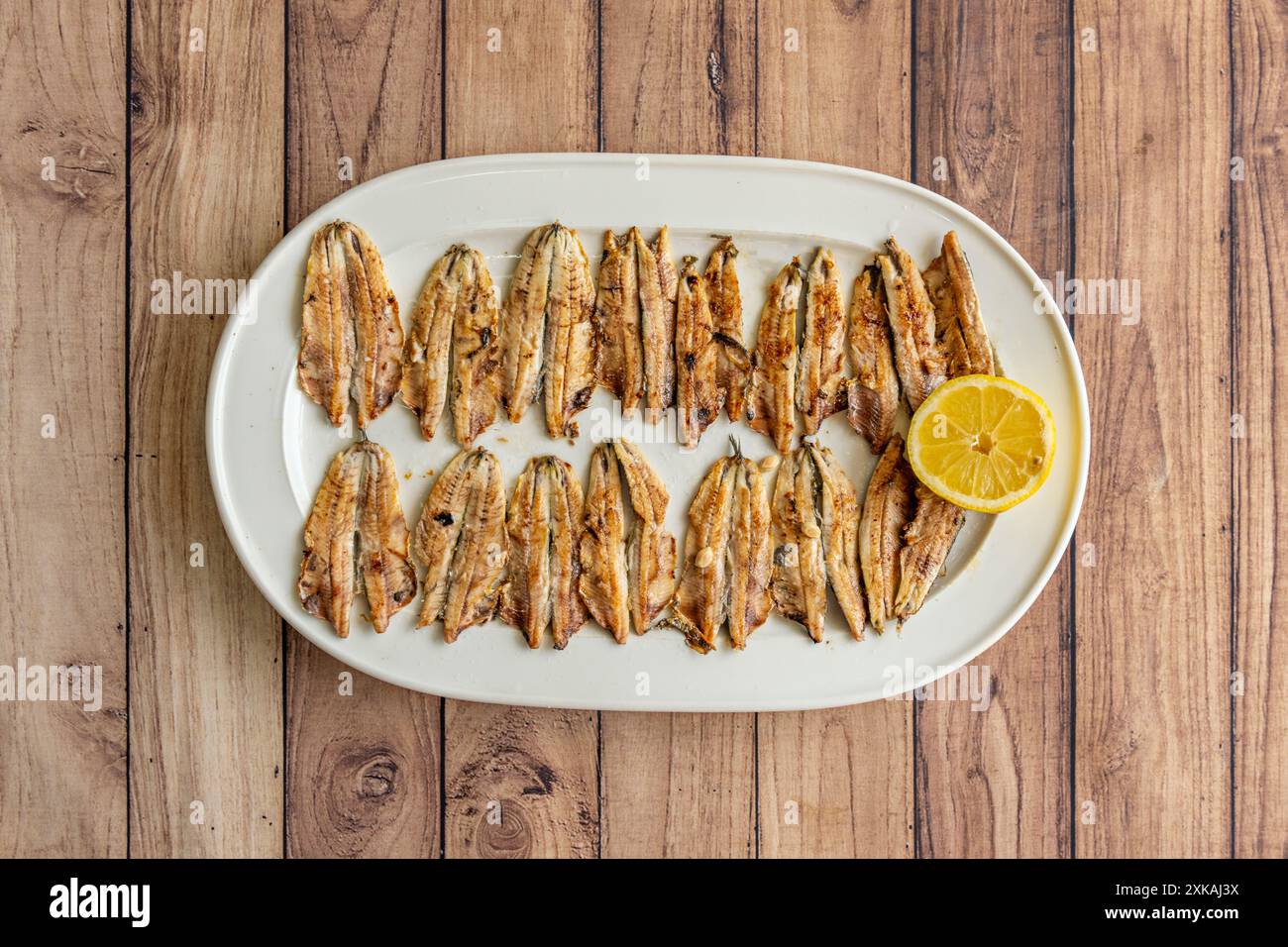 Golden crispy fried anchovies hi-res stock photography and images - Alamy
