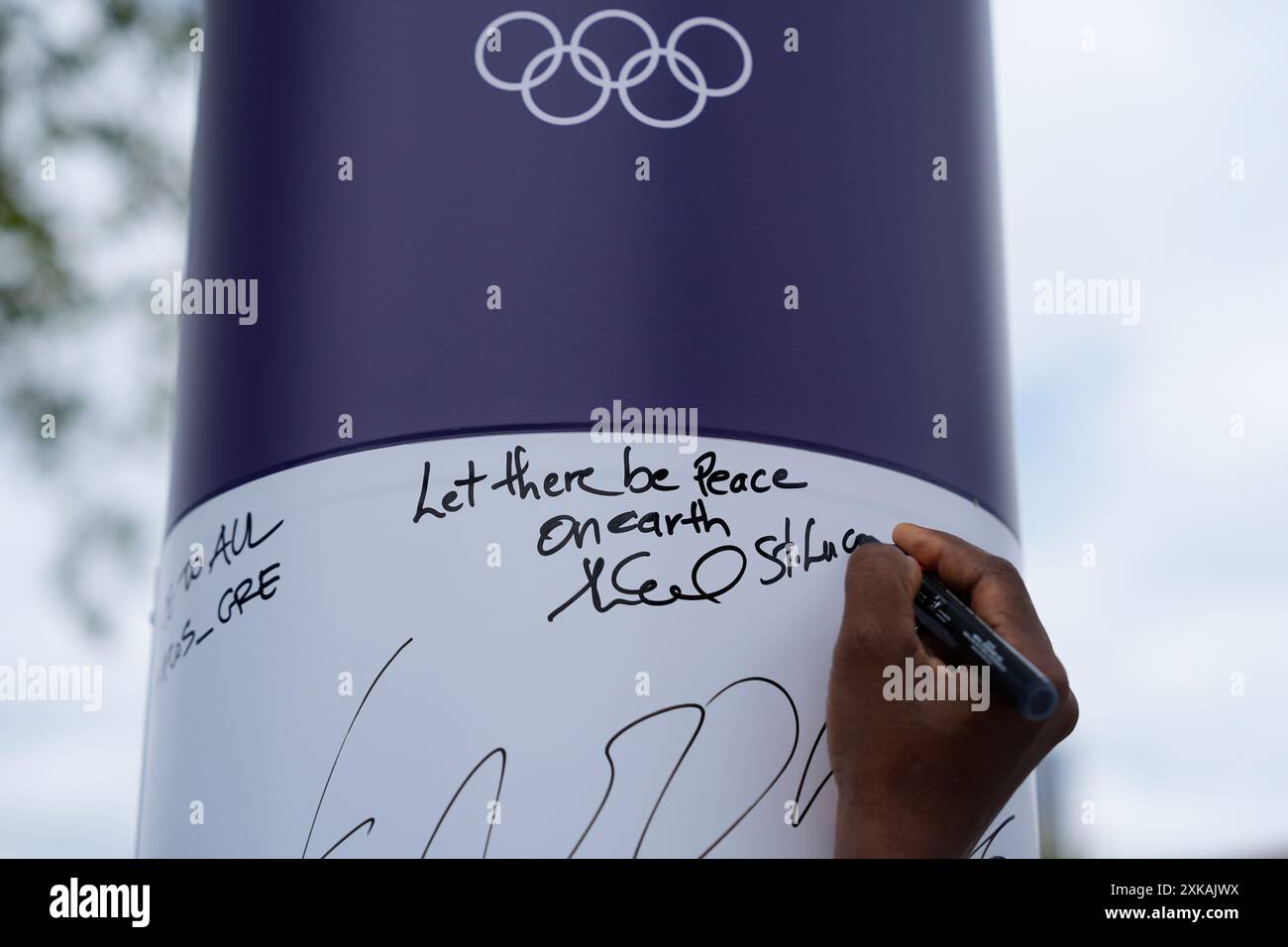 Saint Lucia's Helena Renee-Emmanuel signs on a pole during the ...