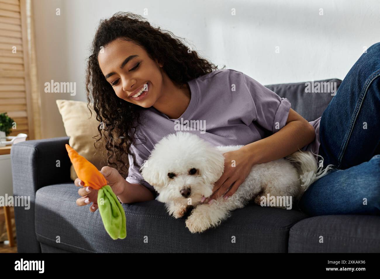 Woman cuddle on dog home hi-res stock photography and images - Alamy