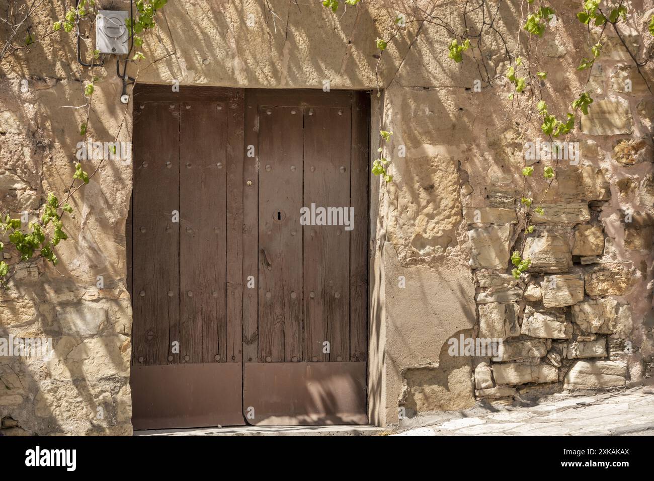 Stone facades with wooden doors combine the strength and durability of ...