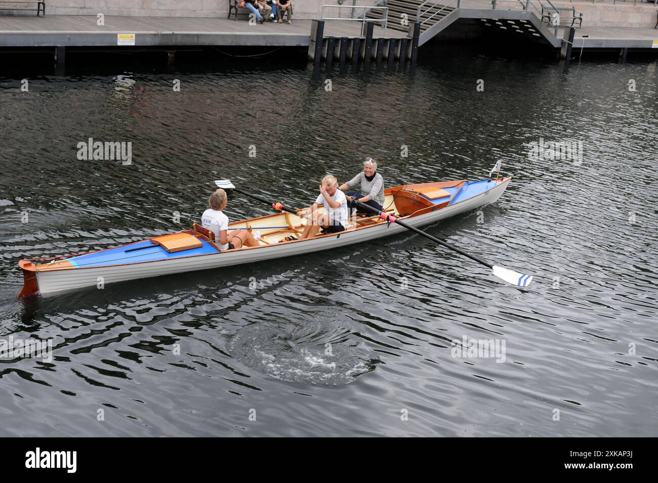 Copenhagen/ Denmark/22 July 2024/Female danes boaT rowing as ports in ...