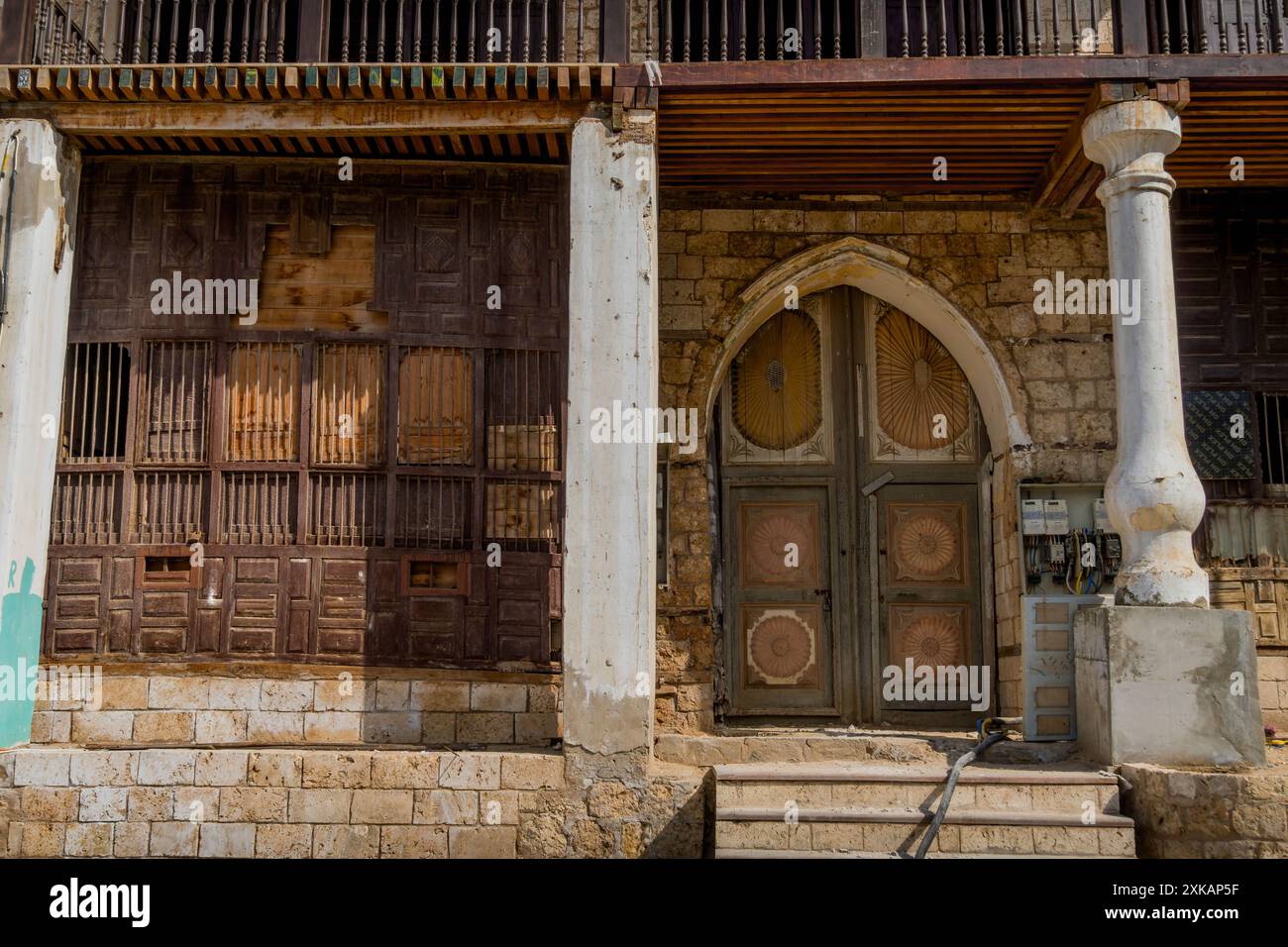 The vintage door and columns, entrance to one of the Jeddah medieval ...