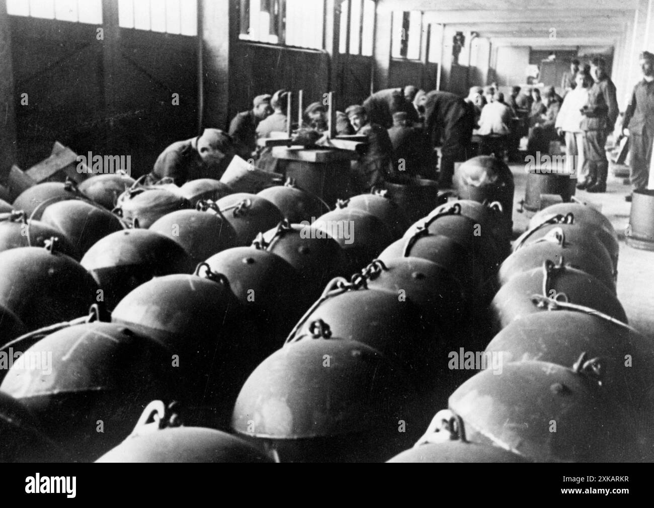 Sea mines are prepared for laying in a German naval arsenal. Photo ...