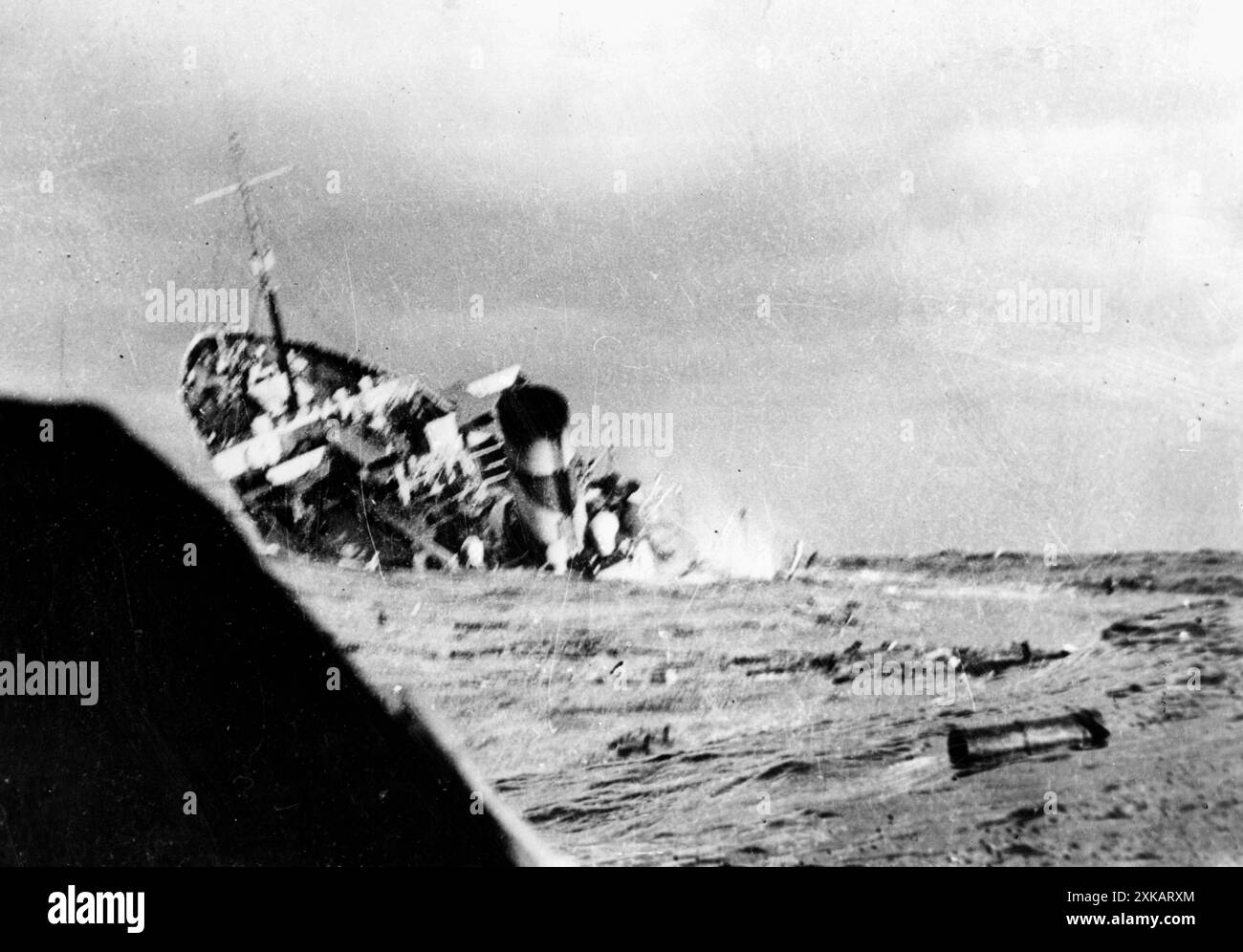 The sinking British auxiliary cruiser F35 Rajputana as part of convoy ...