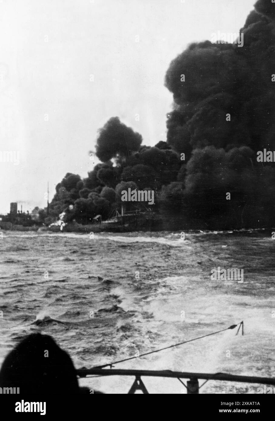 A burning tanker, photographed from aboard the German submarine U 96 ...
