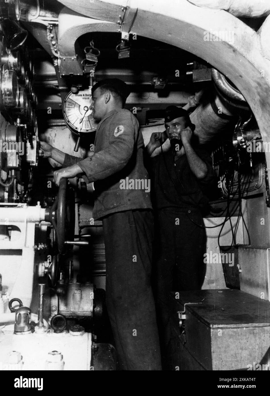 Sailors in the engine room. Undated photograph. [automated translation ...