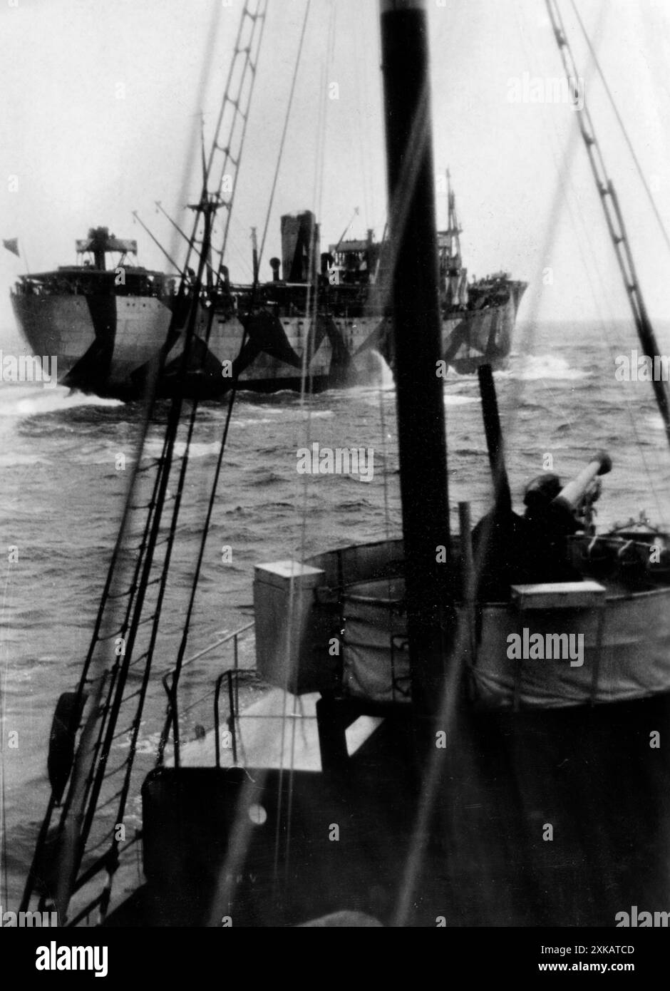 Freighter of a convoy, seen from an escorting outpost boat. Photo ...