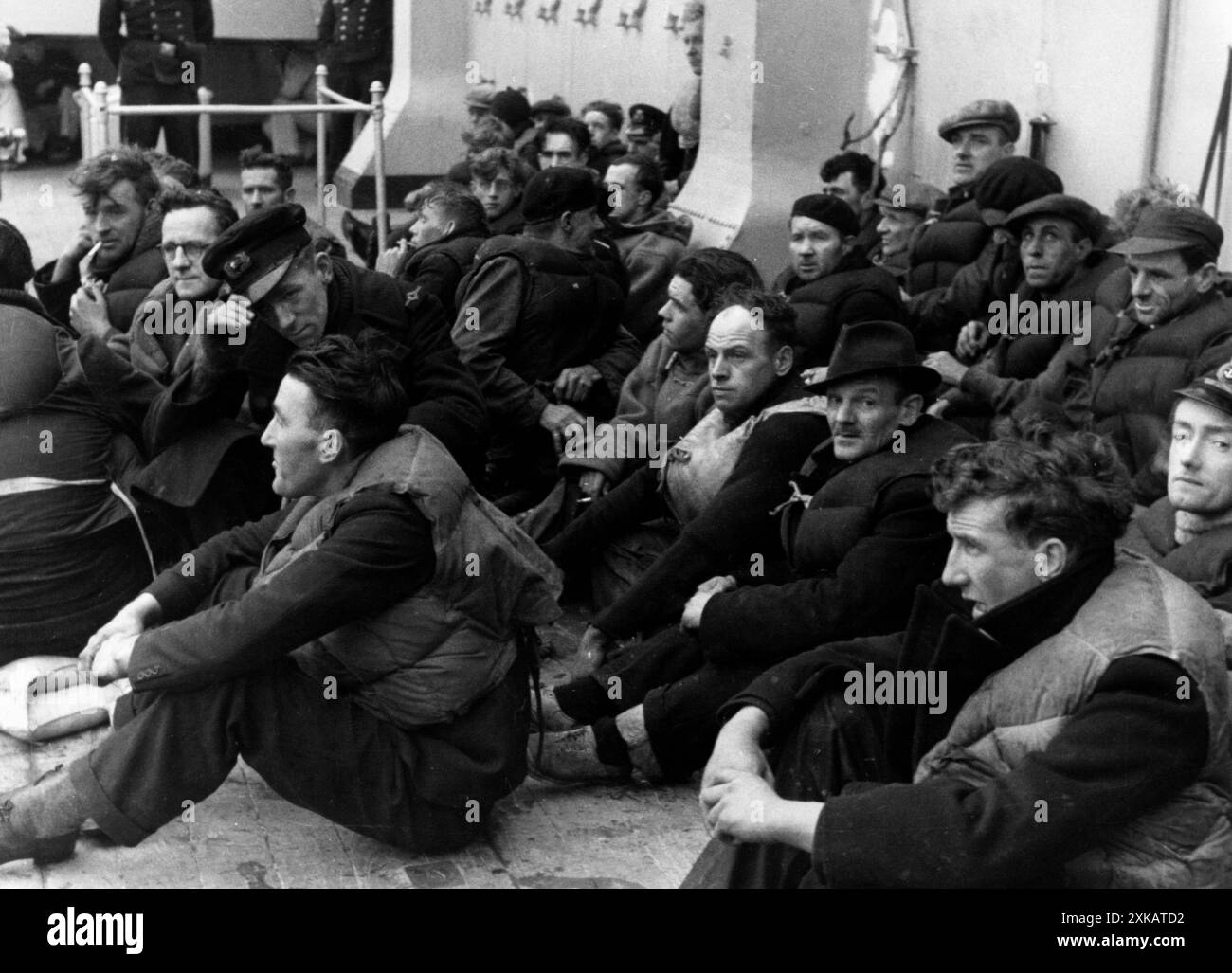 Members of the crew of a sunken British tanker on board a German ...