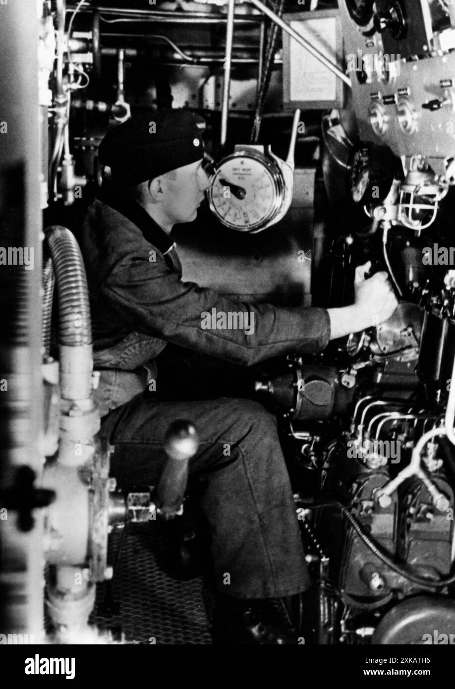 Engineer's mate in the engine room of a speedboat. [automated ...