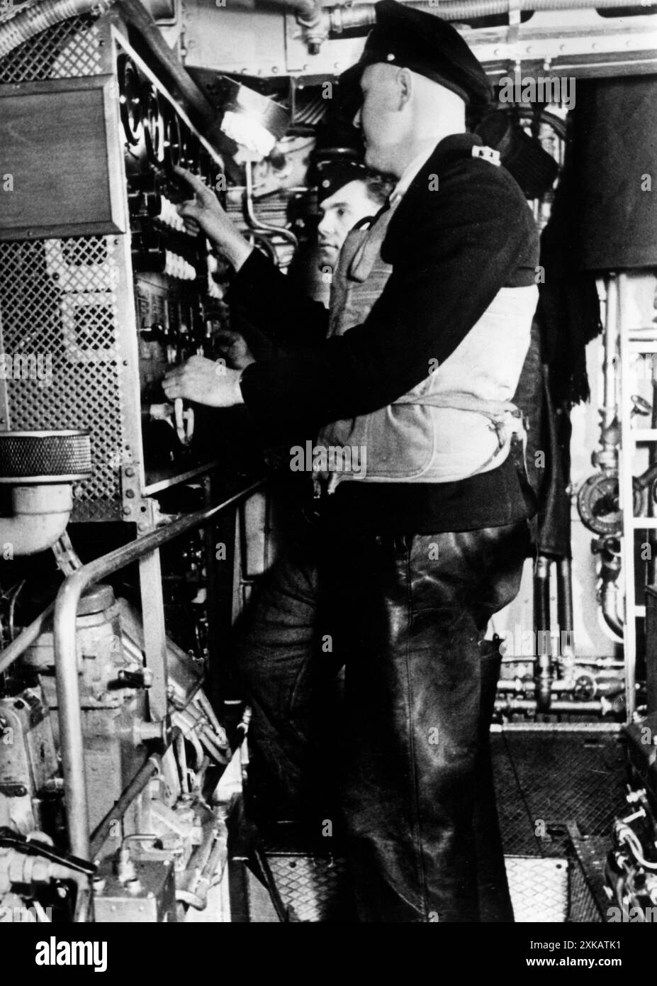 The chief engineer at the engine control station of a speedboat. Photo ...