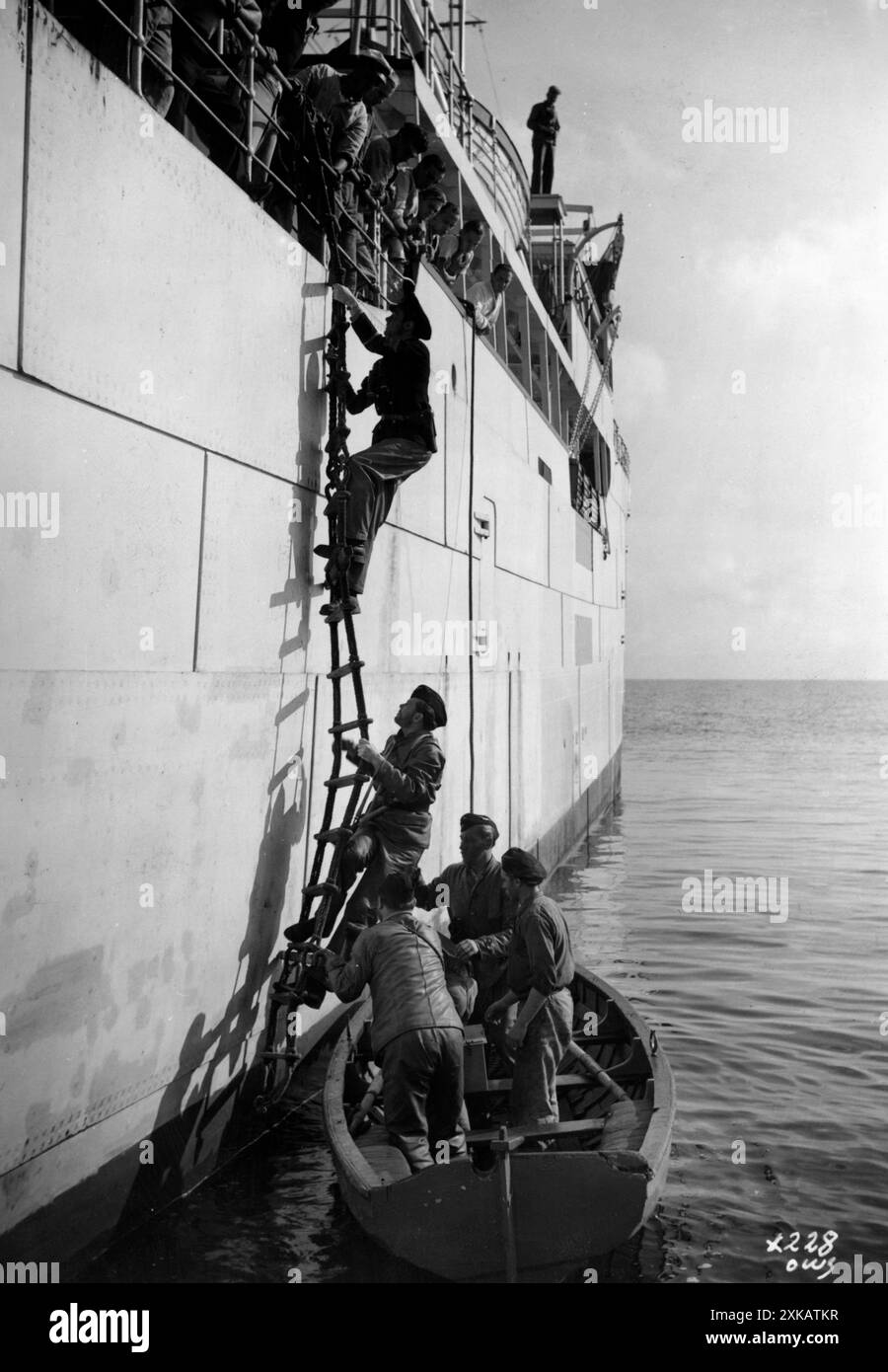 German sailors climb aboard a freighter. Possibly film image ...
