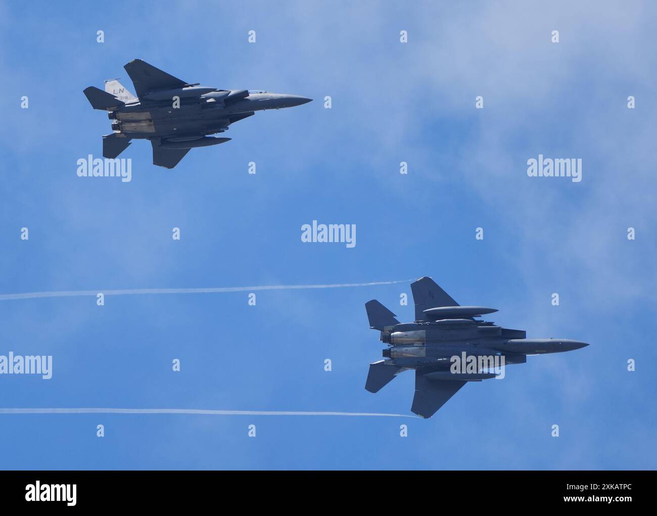 A pair of U.S. Air Force F-15E Strike Eagle aircraft perform a fly past ...