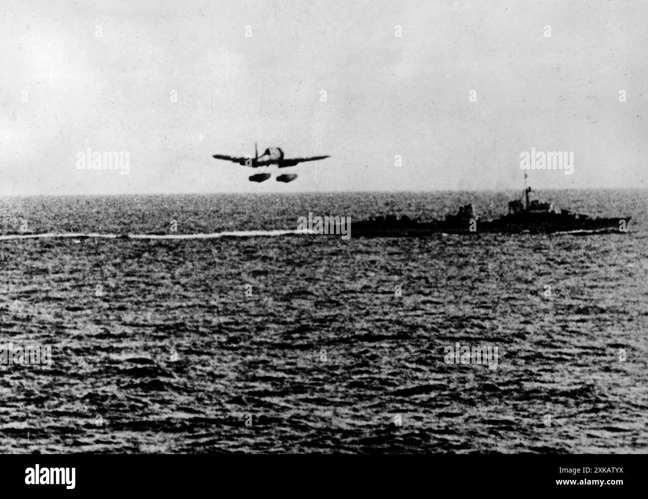 A German destroyer at sea. Above it, an Arado AR 196 reconnaissance ...