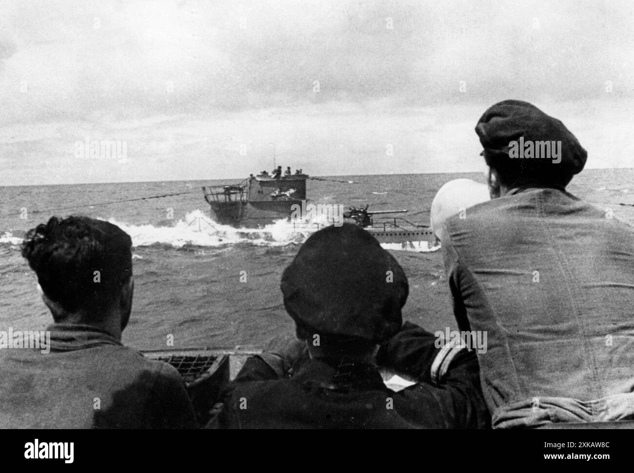 Two German submarines meet in the Atlantic. Both commanders speak with ...