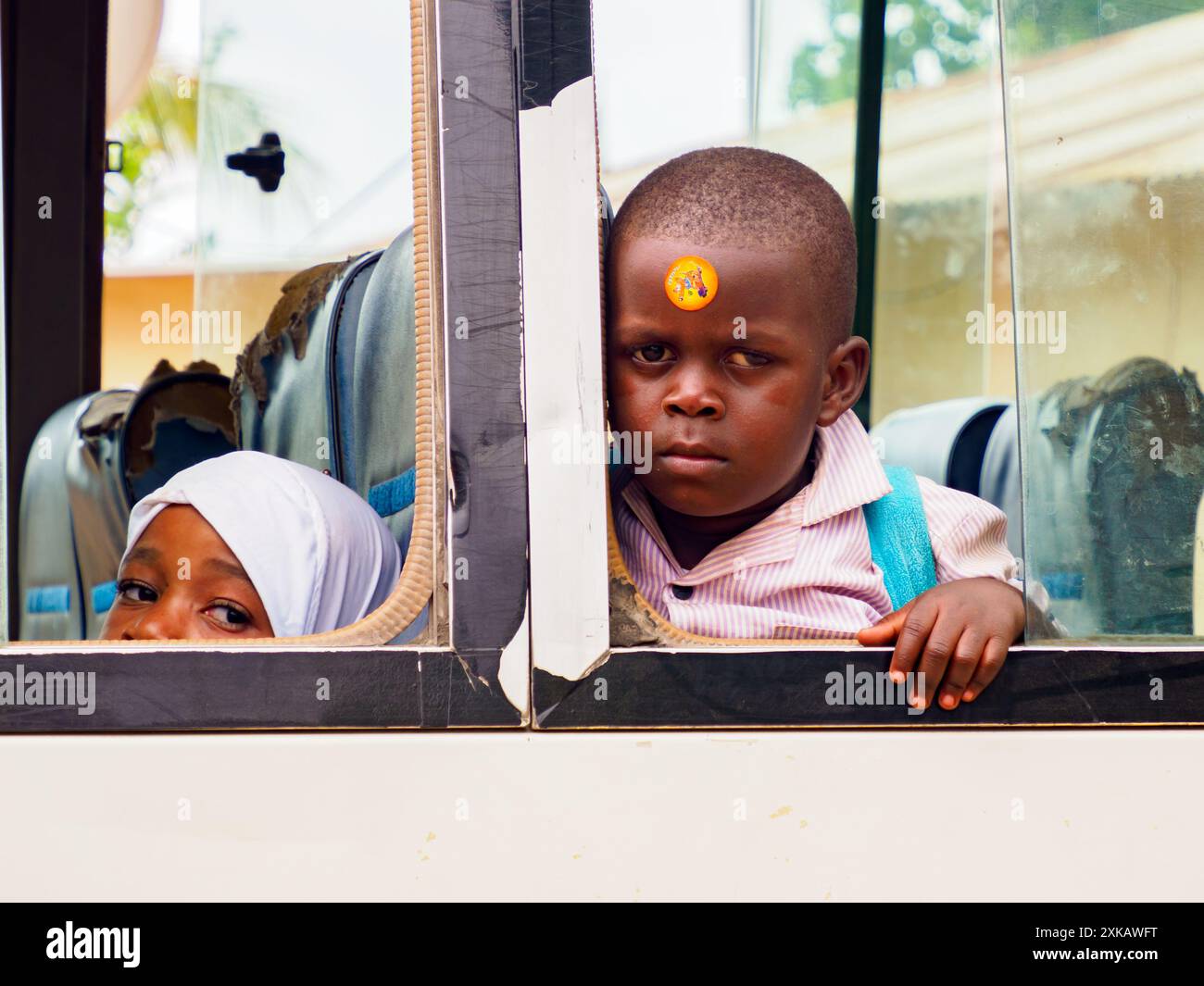 Zanzibar, Tanzania- Jan, 2021: African children in the bus coming back ...