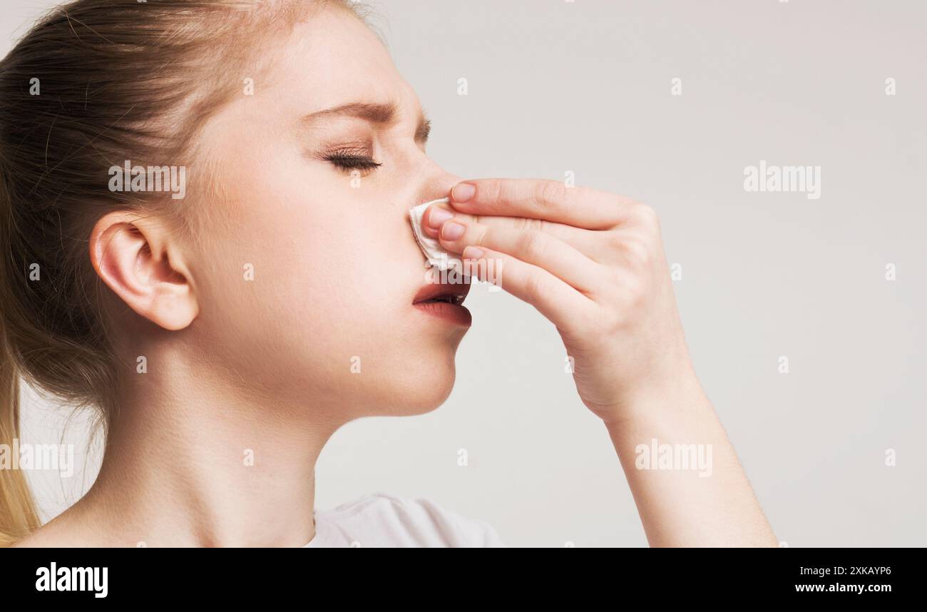 Young woman suffering from nose bleeding, panorama Stock Photo - Alamy