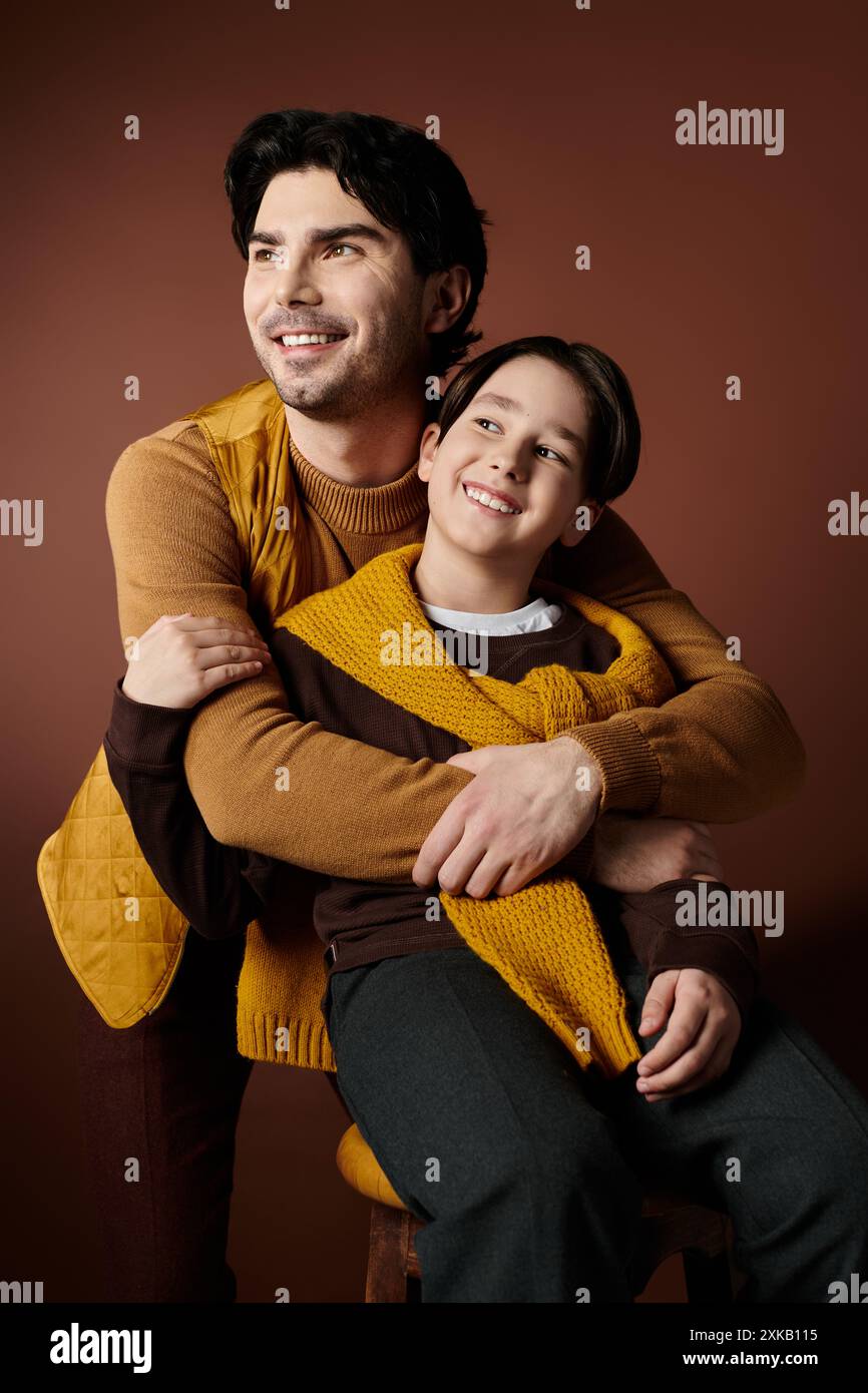 A father and son share a tender embrace, their faces full of affection ...