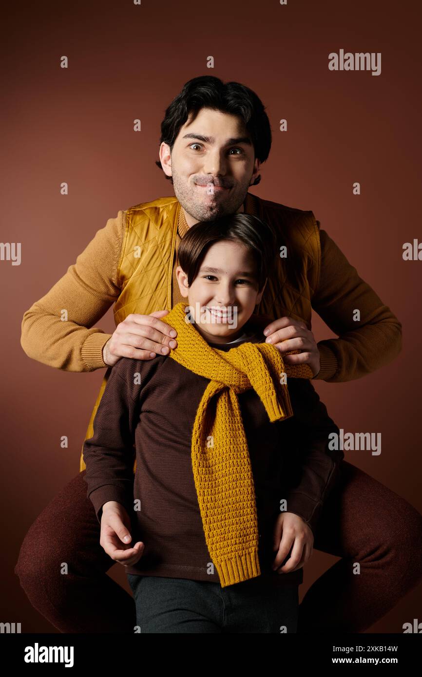 A father and son pose for a portrait with playful expressions Stock ...