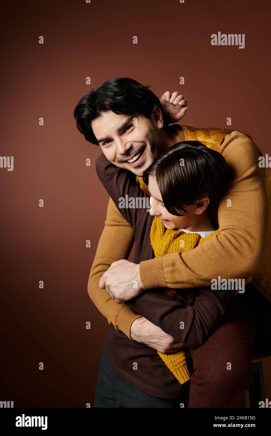 A father and son share a loving embrace in a studio setting, capturing ...