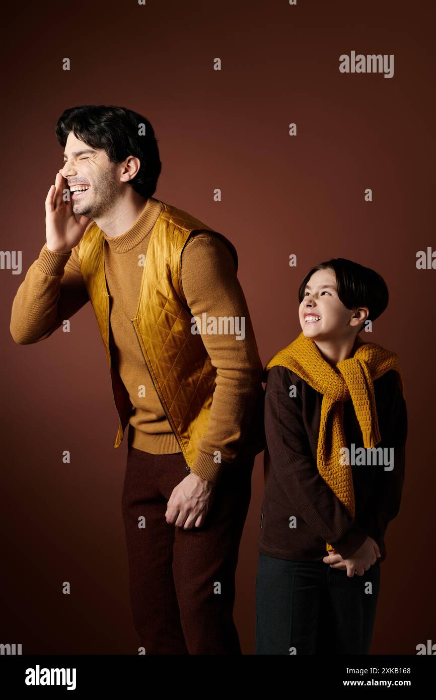 A father and son stand close together Stock Photo - Alamy